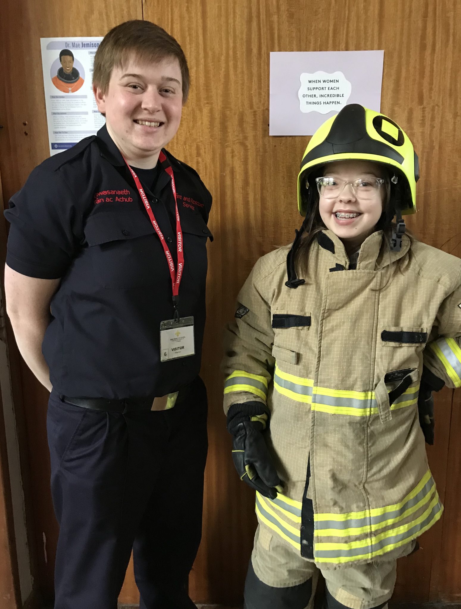 Firefighter Kelly Christopher with pupil - Monmouthshire